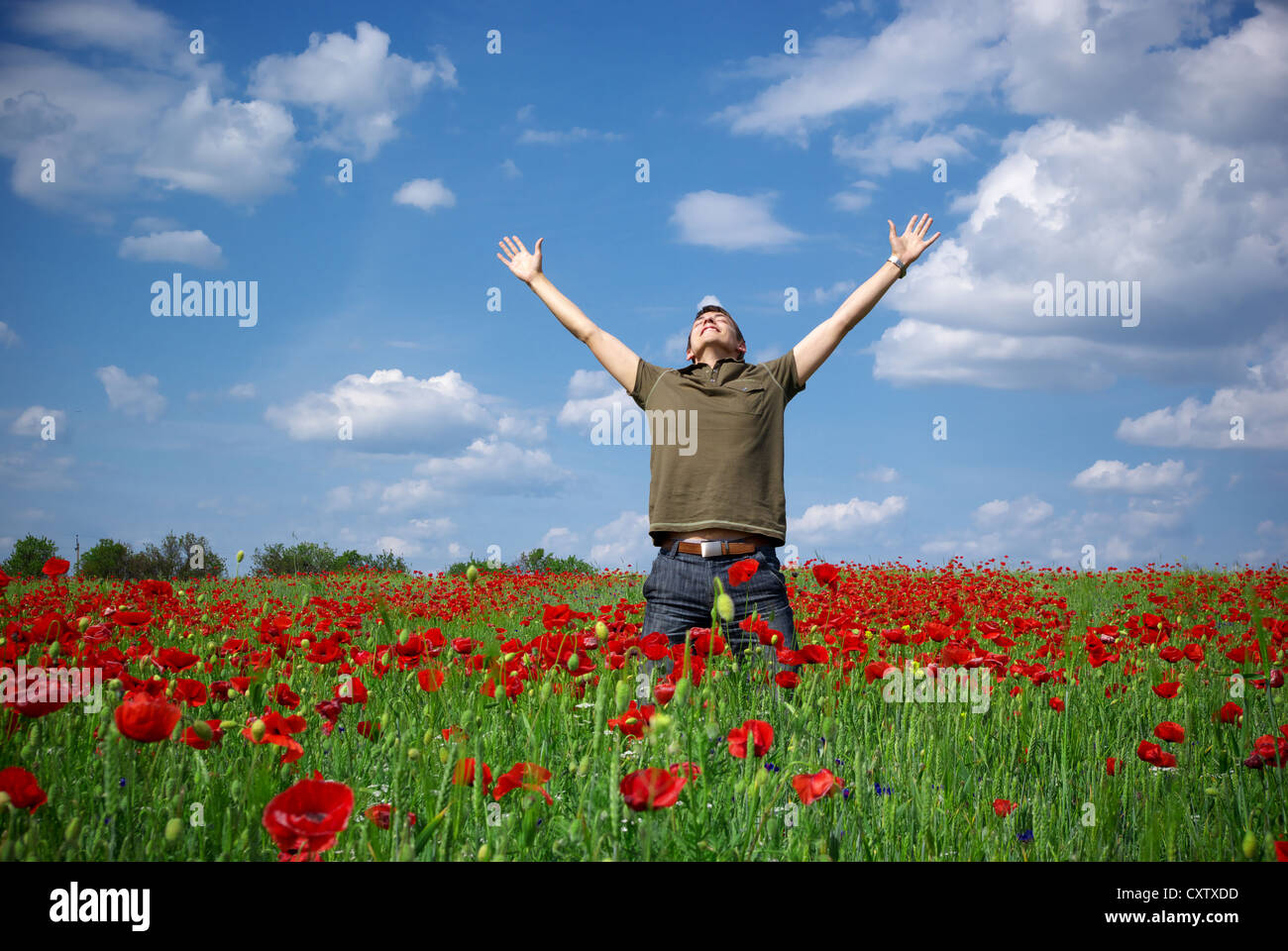 In poppy field. Emotion scene Stock Photo - Alamy