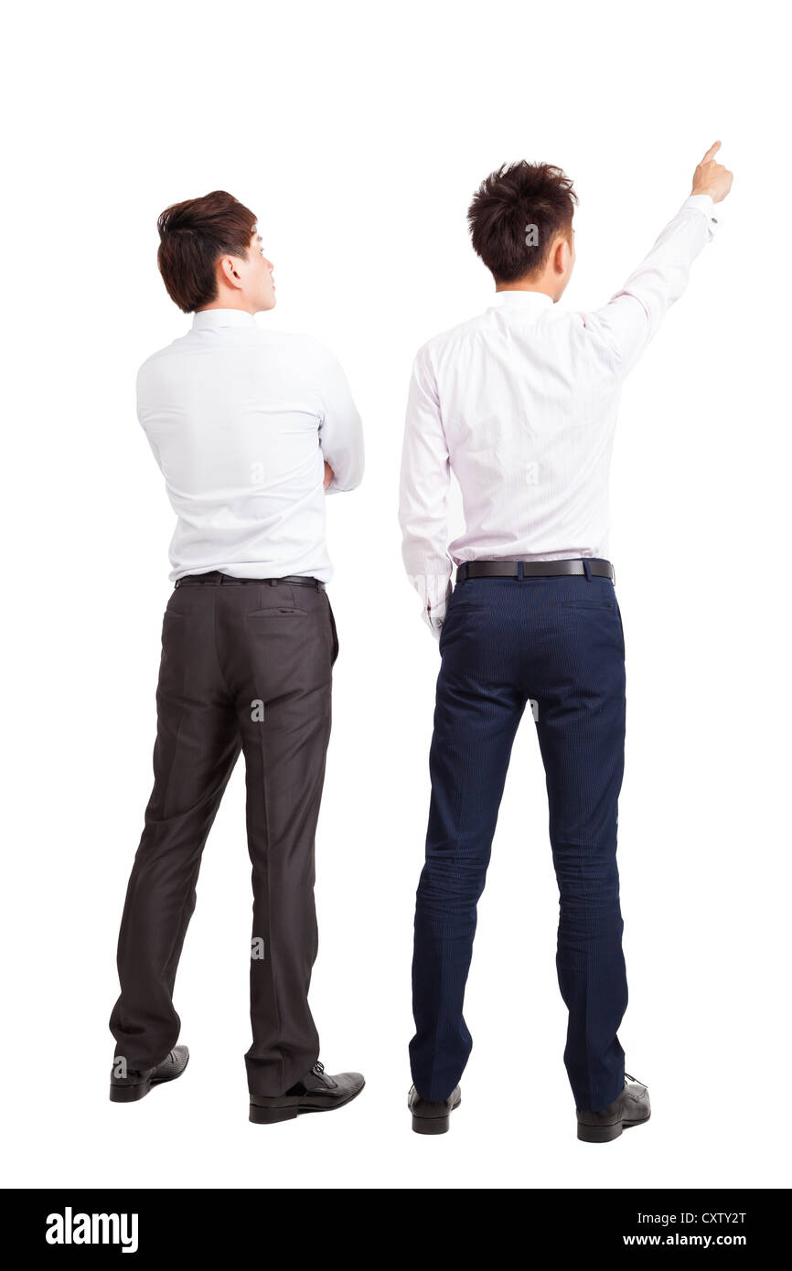 full length of two businessman pointing and looking Stock Photo - Alamy