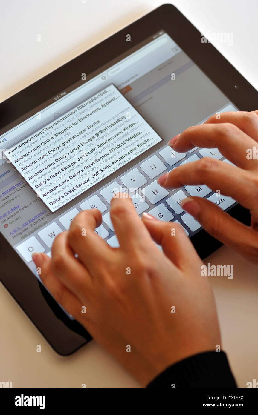 Google search on iPad and student typing Stock Photo - Alamy