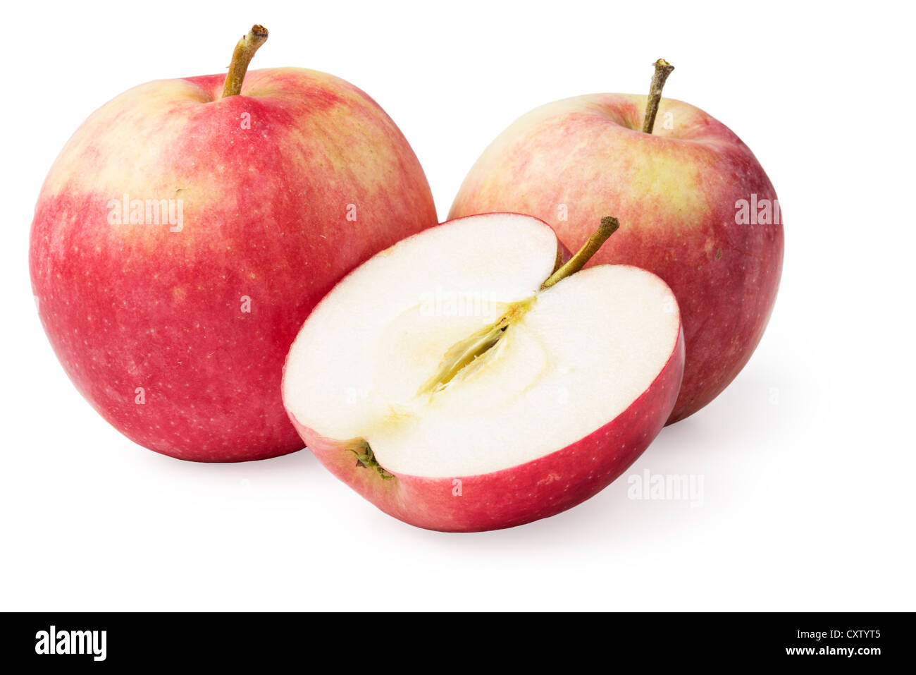 two whole apples and a half of an apple isolated on white background ...