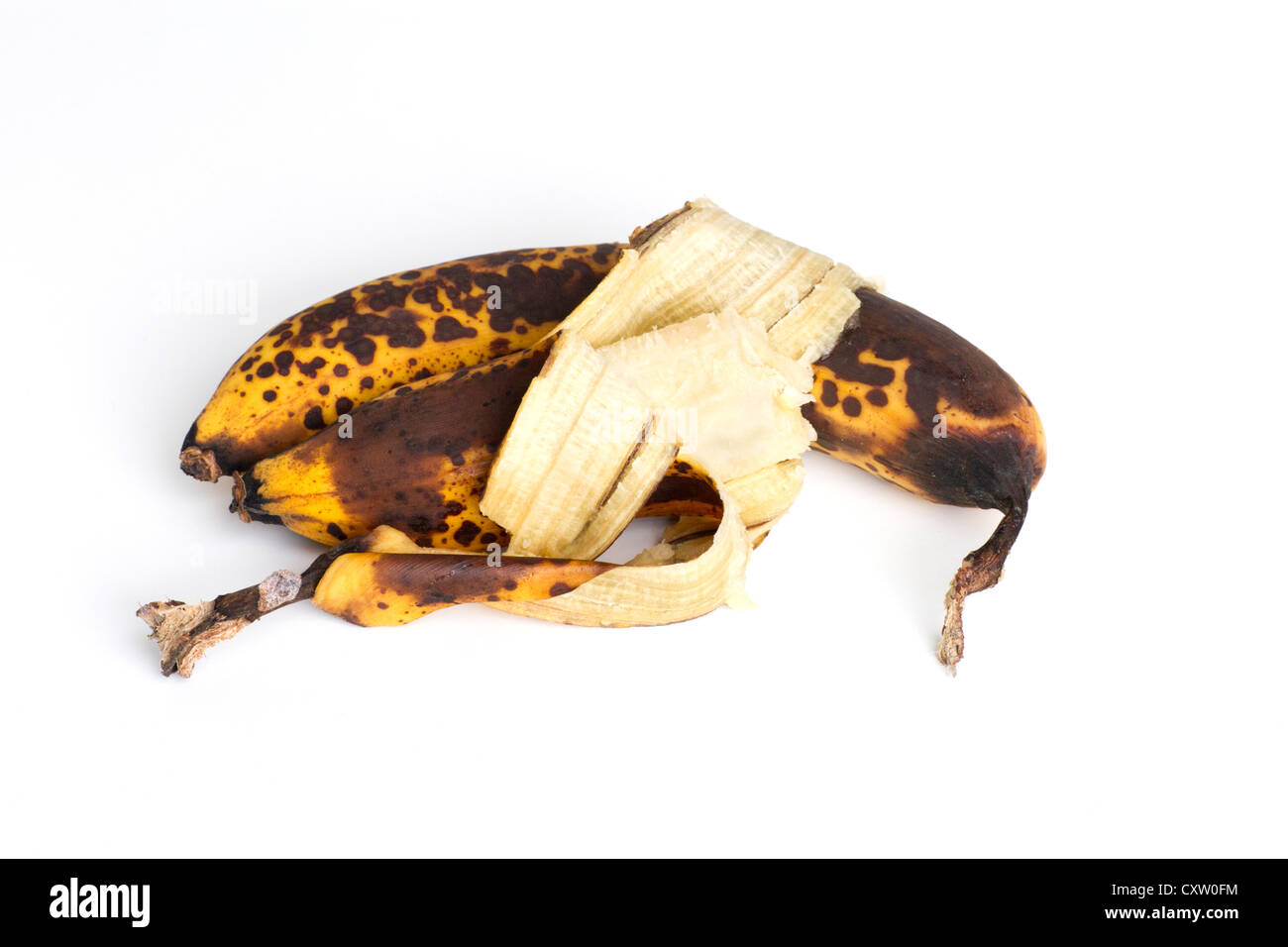 Two overly ripe bananas isolated on white background Stock Photo - Alamy