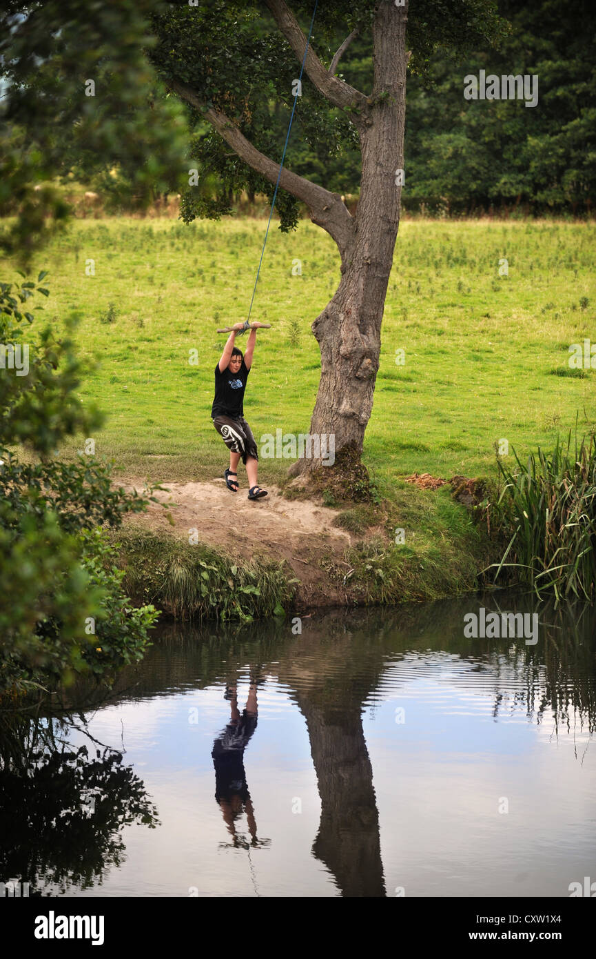 Rope swing over lake hi-res stock photography and images - Alamy