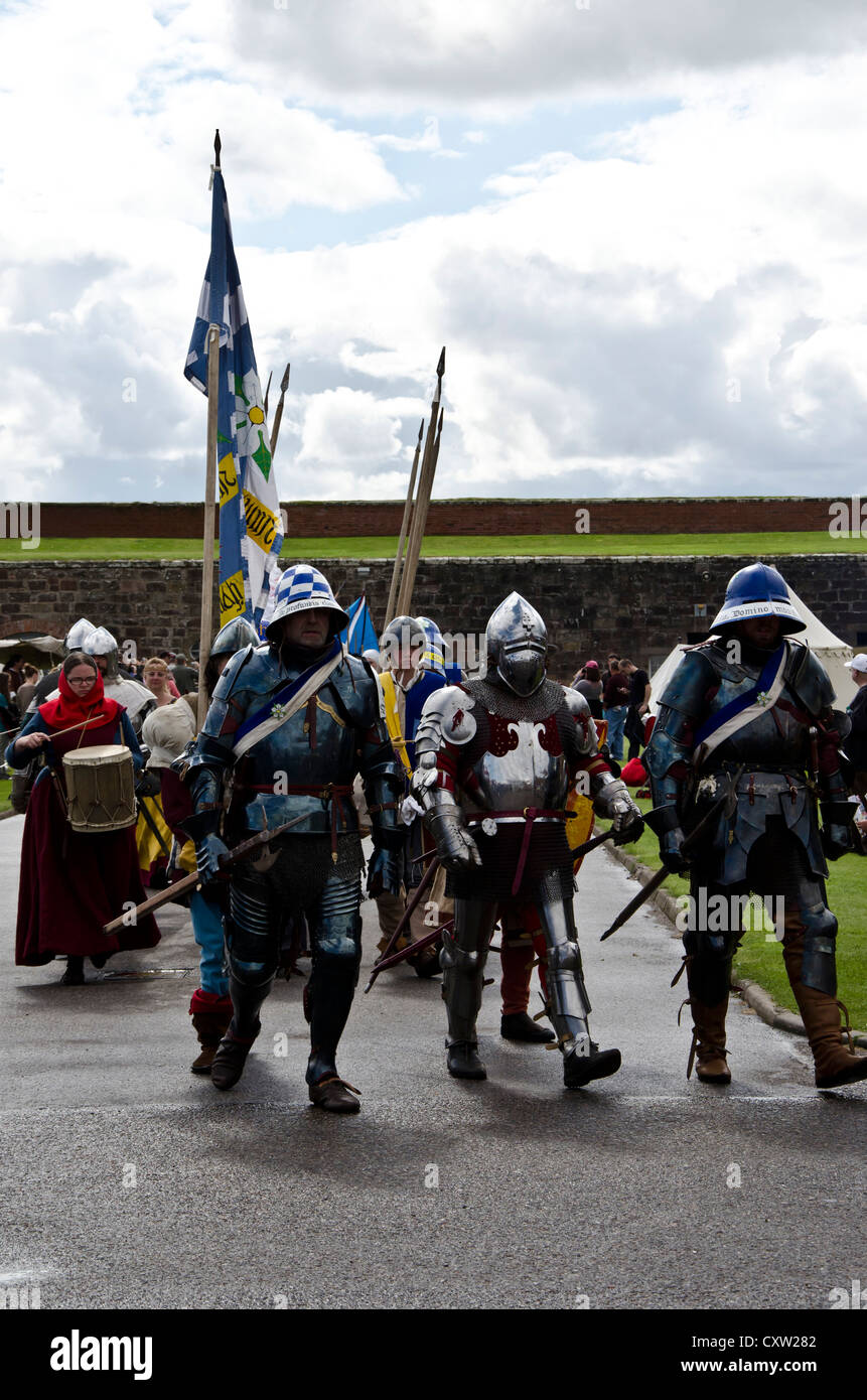 Men in medieval Scottish military dress at an historic event at Fort ...