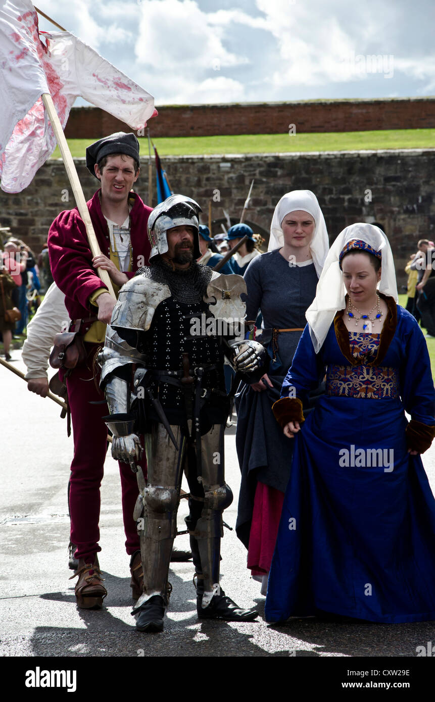 People in medieval Scottish dress at an historic event at Fort George ...