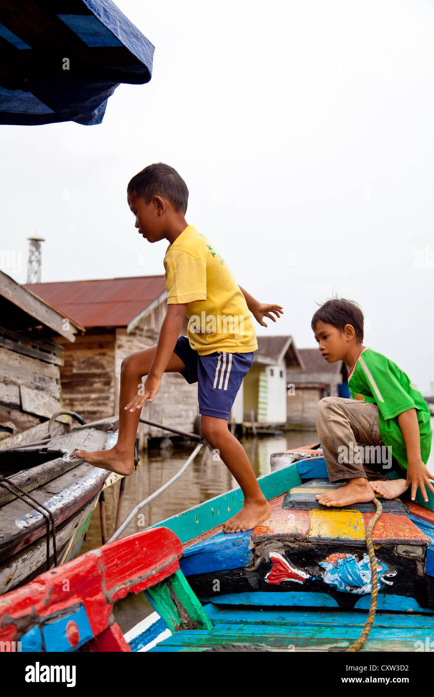 Indonesia boat boys hi-res stock photography and images - Alamy