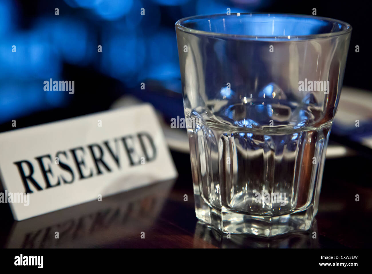 Reserved sign and empty glass Stock Photo - Alamy