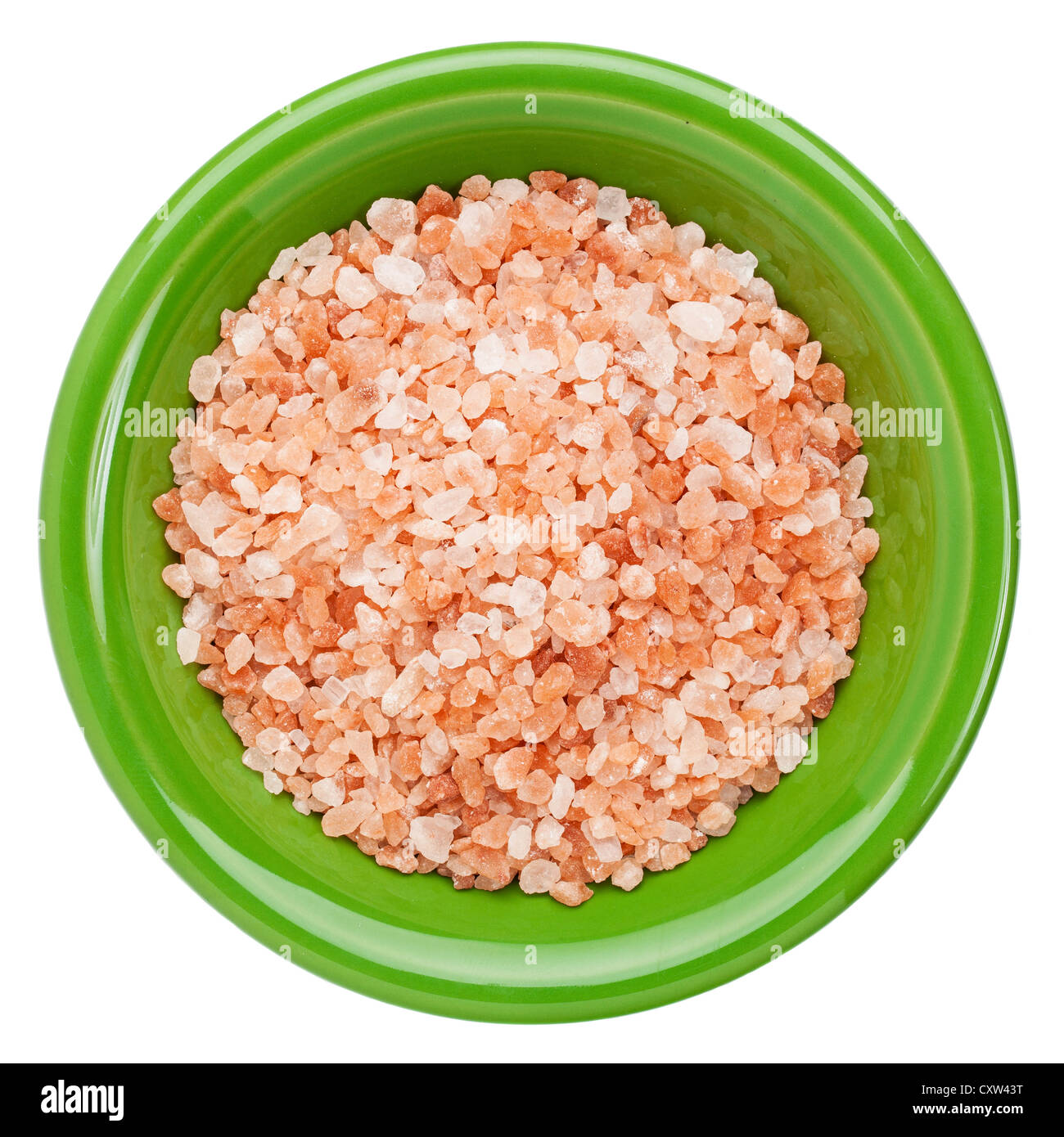 Himalayan salt coarse crystals in green ceramic bowl isolated on white ...