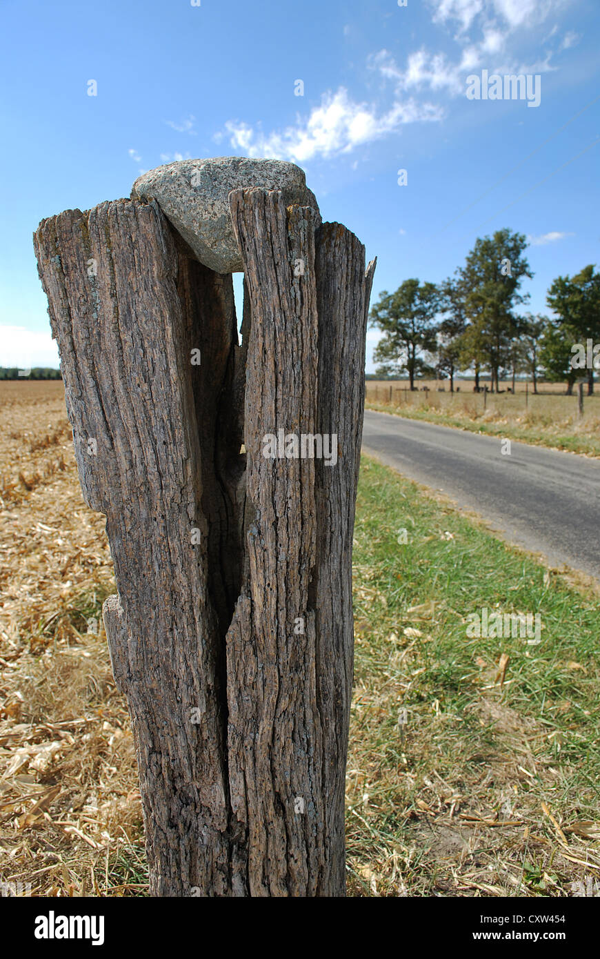 A weathered fence post alongside a rural road in Indiana Stock Photo ...