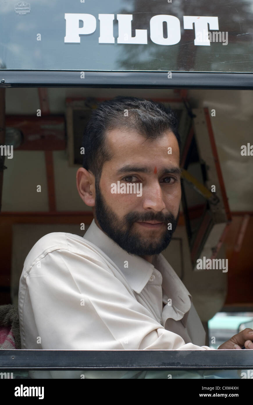 A bus driver poses for the camera in Manali, North India Stock Photo ...