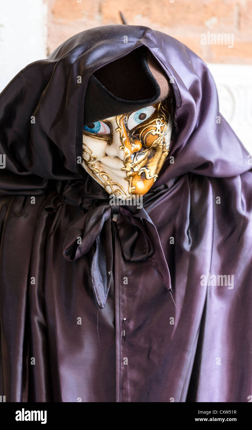 A mannequin wearing a typical Venetian mask, in this case a modern take ...