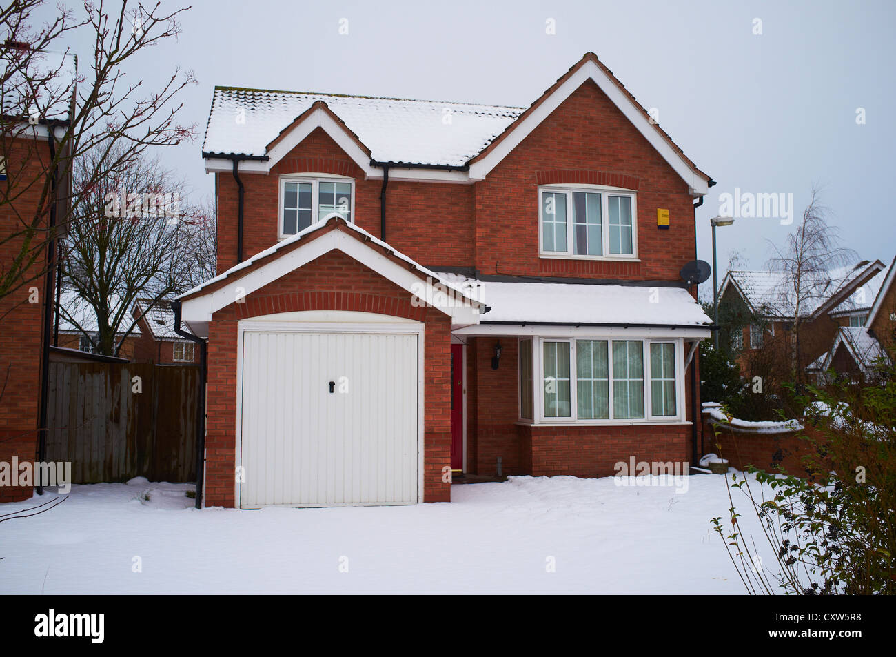 Detached red brick house covered in snow Sutton Coldfield Birmingham UK ...