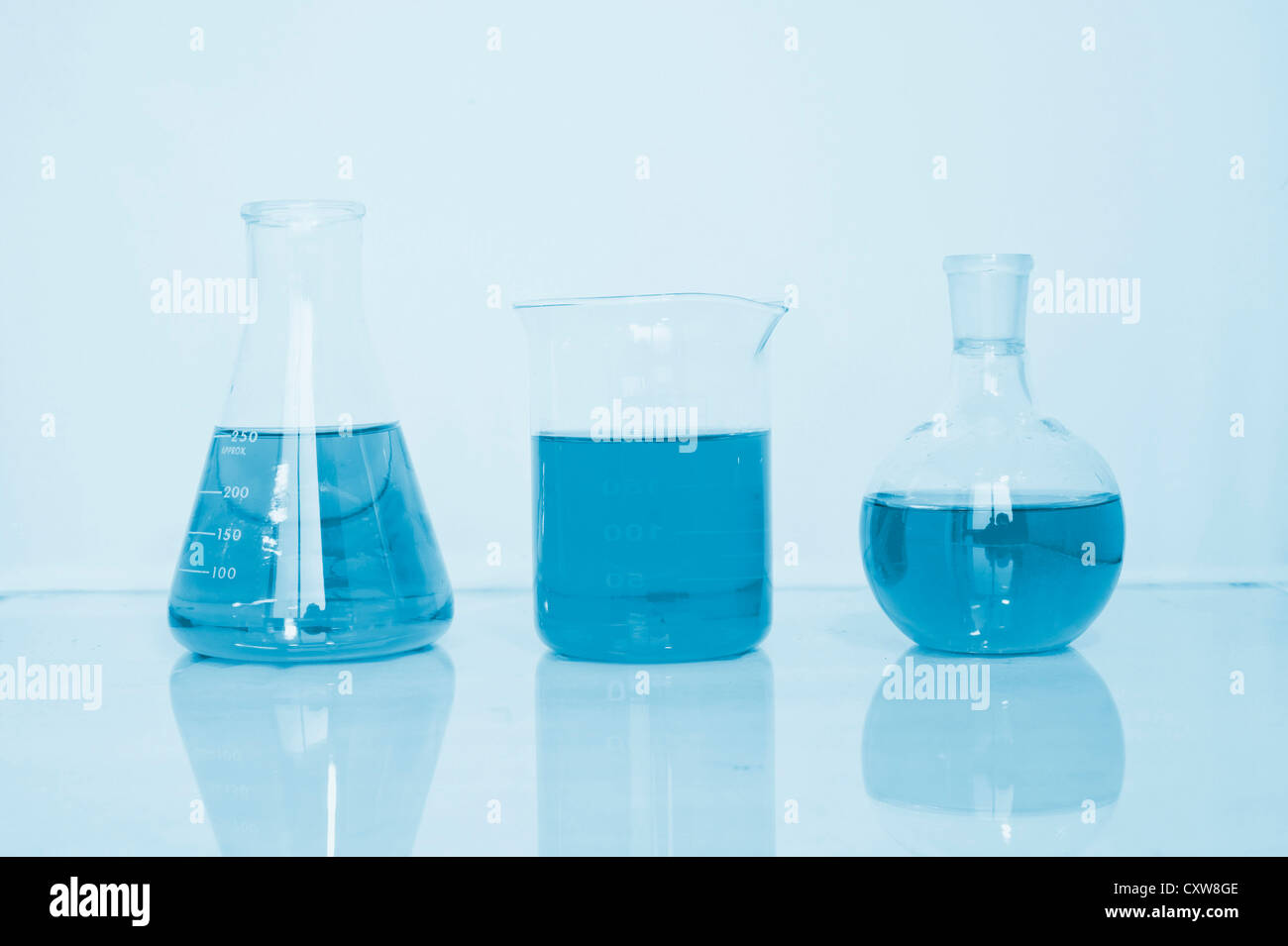 Laboratory glassware with various colored liquids Stock Photo - Alamy