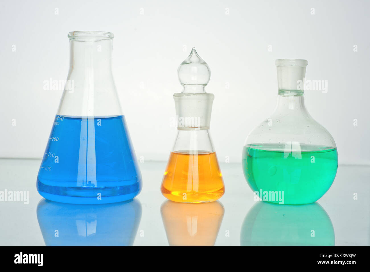 Laboratory glassware with various colored liquids Stock Photo - Alamy