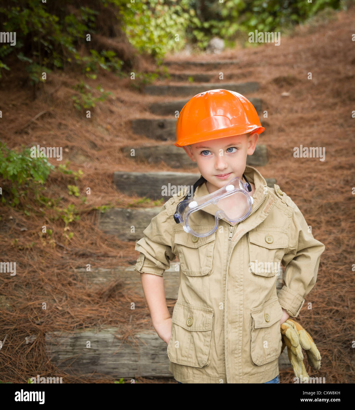 Happy Adorable Child Boy with Big Gloves, Hard Hat and Goggles Playing ...