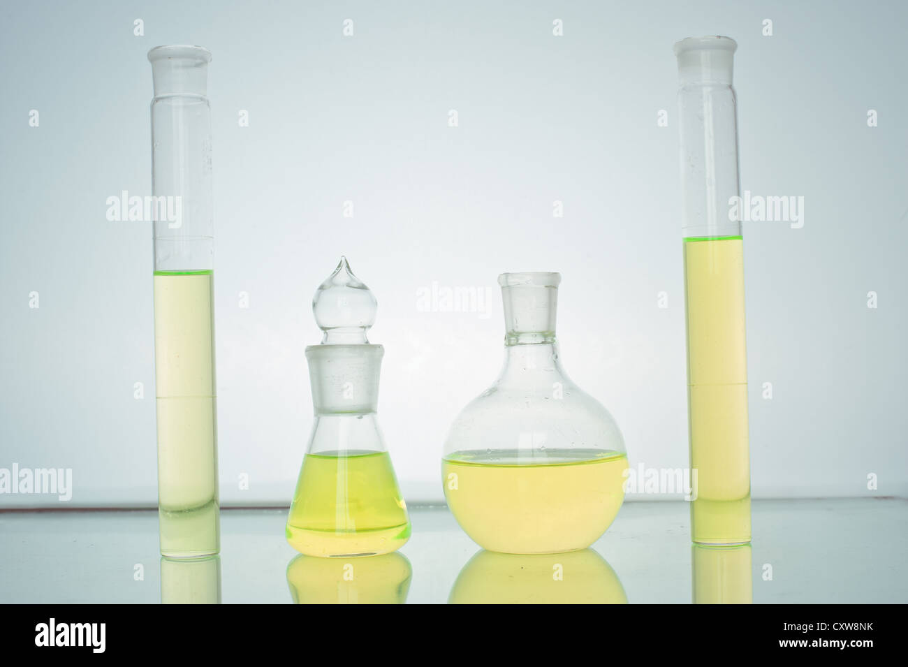 Laboratory glassware with various colored liquids Stock Photo - Alamy
