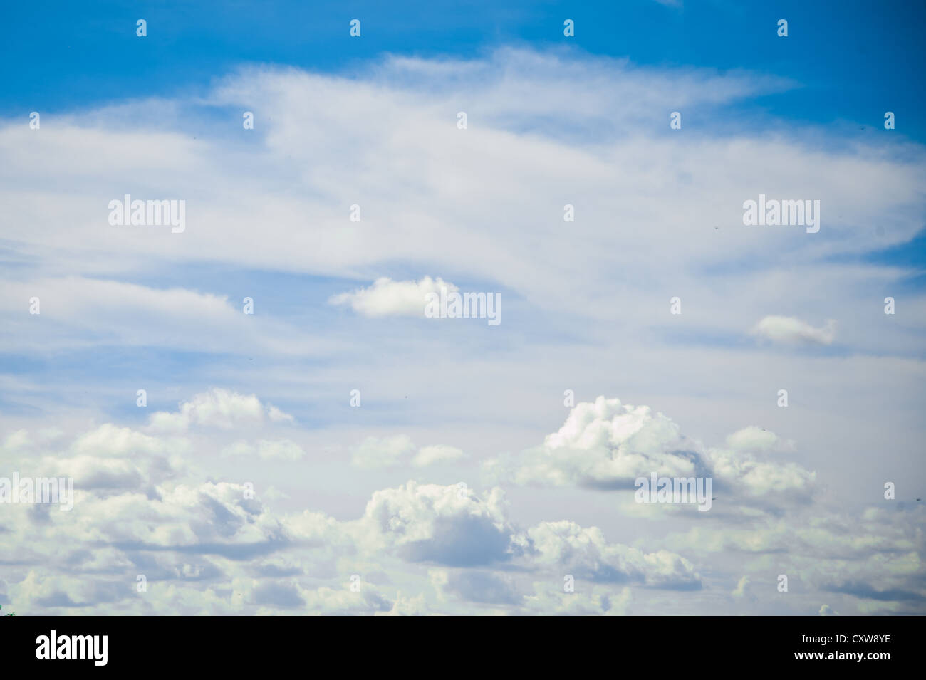 White sparse clouds over blue sky Stock Photo - Alamy