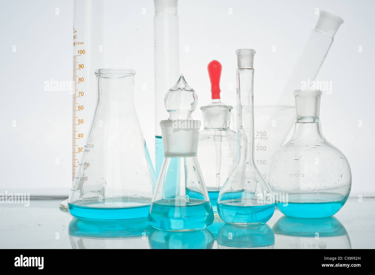 Laboratory glassware with various colored liquids Stock Photo - Alamy