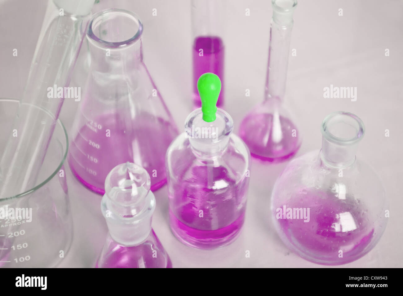 Laboratory glassware with various colored liquids Stock Photo - Alamy