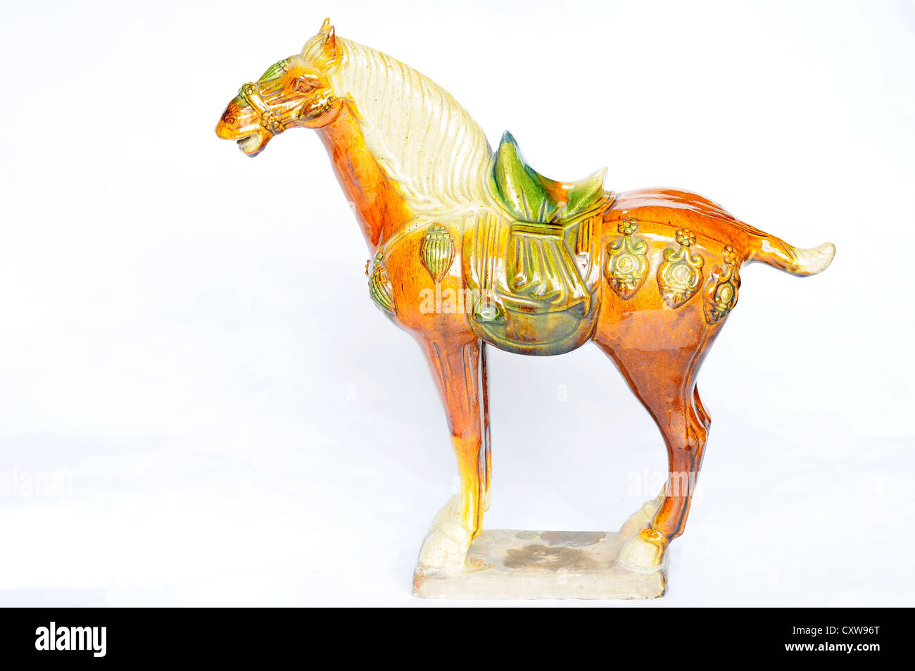 Tri-colored glazed pottery of the Tang Dynasty on a white background ...