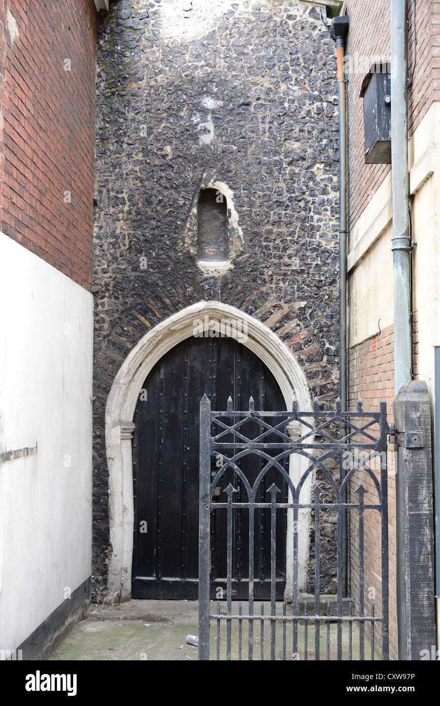 Ancient Archway and door with half open gate Stock Photo - Alamy