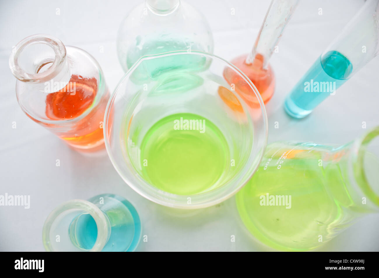 Laboratory glassware with various colored liquids Stock Photo - Alamy