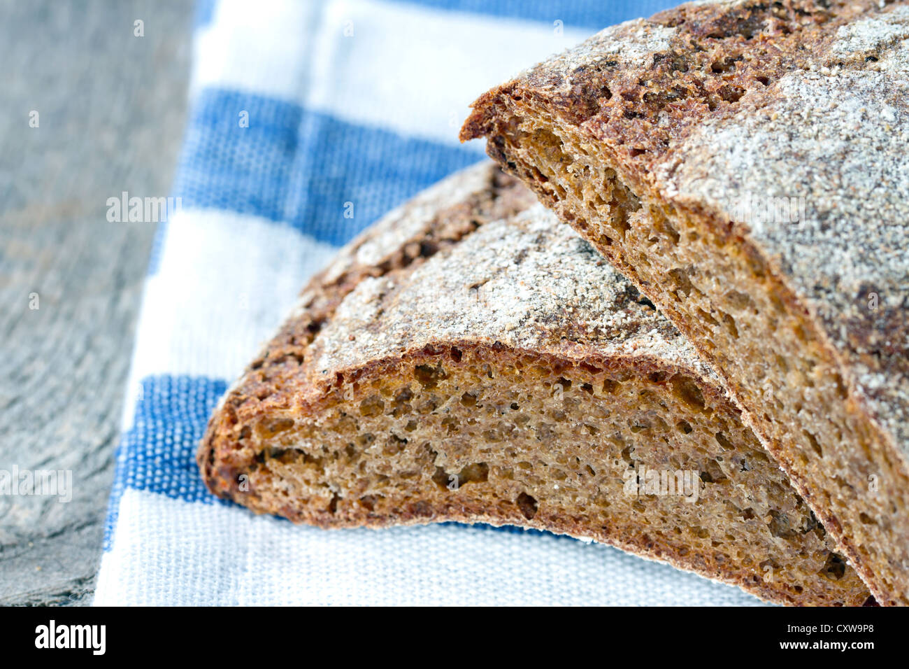 Organic dark wholegrain rye bread, a new superfood, closeup on rustic ...