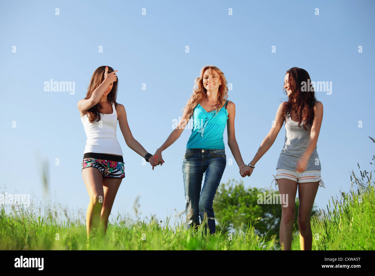 women fun on grass field Stock Photo - Alamy