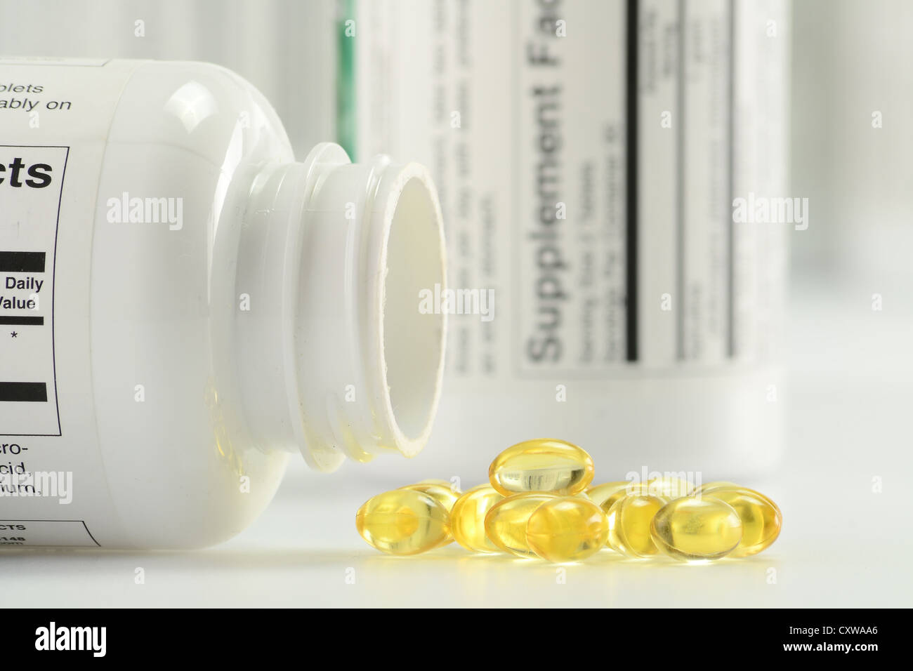 Composition with dietary supplement capsules and containers Stock Photo ...