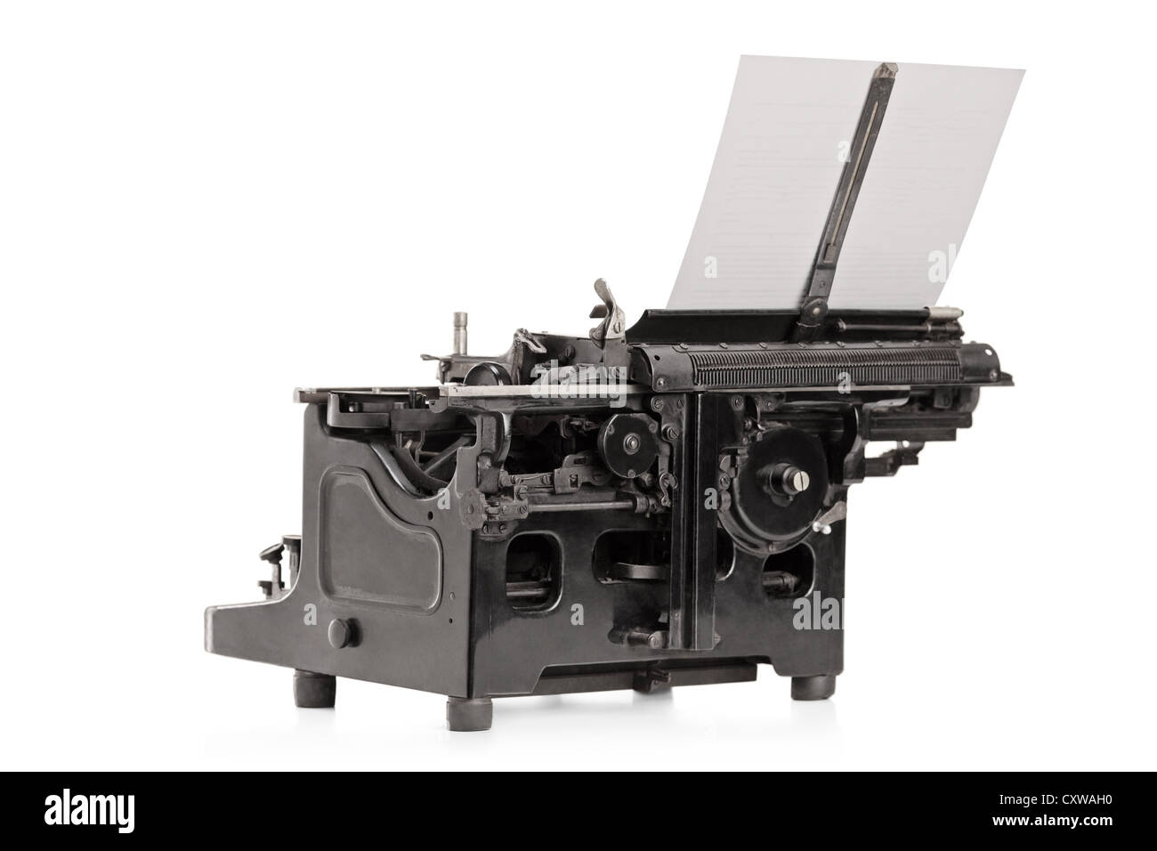 A studio shot of an old style typing machine isolated on white ...