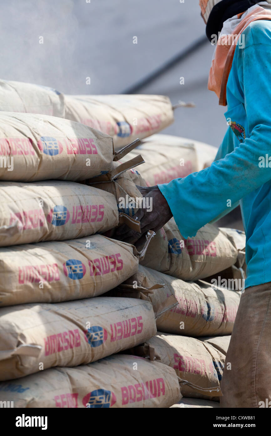 Workers unloading Cement Bags in the Port Sunda Kelapa in Jakarta ...