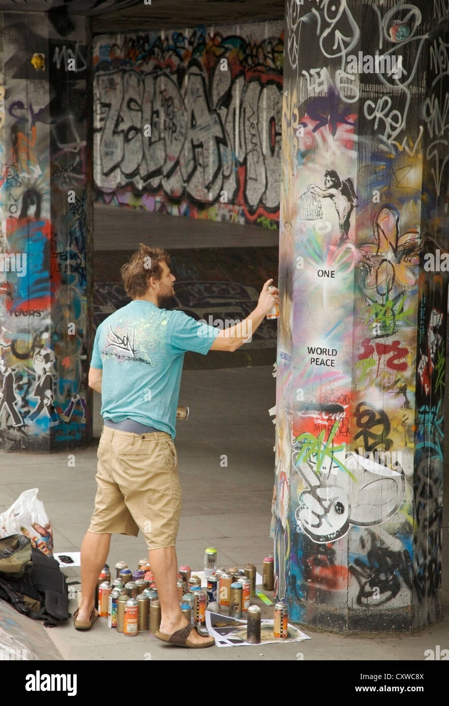 Graffiti artist Paul Don Smith creating a portrait of Jimi Hendrix, at ...