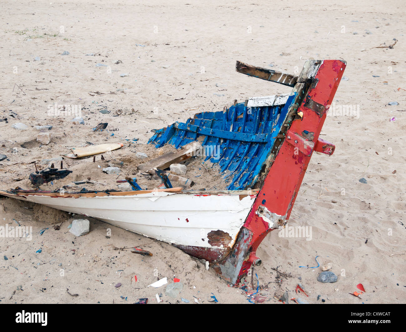 Shattered remains of a wrecked and abandoned fishing boat or coble on ...