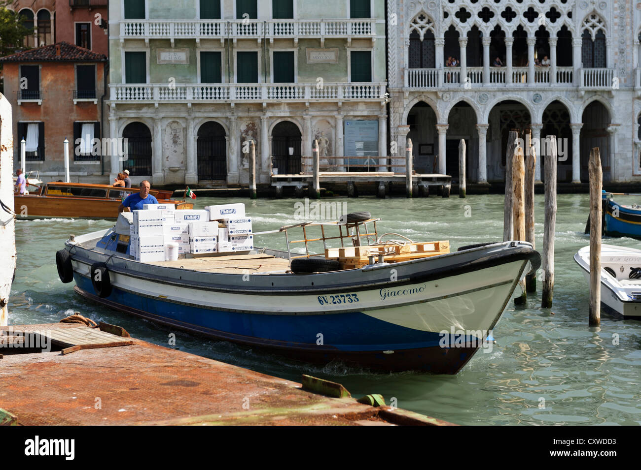 Barge carrying goods on Grand Canal, Venice, Italy Stock Photo - Alamy