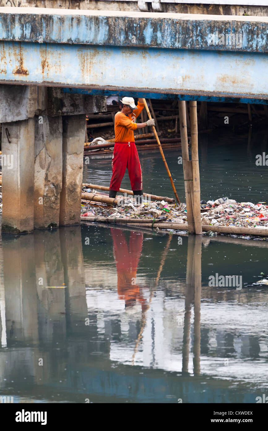 Workers cleaning a Canal in Jakarta, Indonesia Stock Photo - Alamy