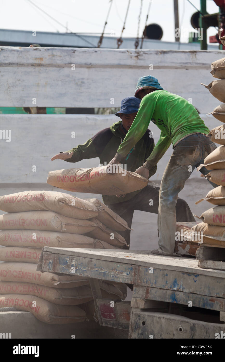 Workers unloading Cement Bags from a Ship in the Port Sunda Kalapa in ...