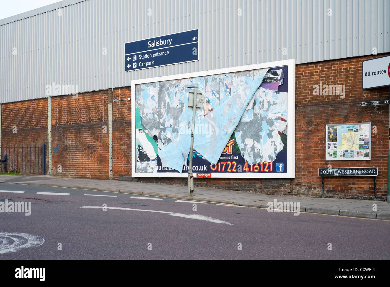 Torn and peeling billboard poster Stock Photo - Alamy