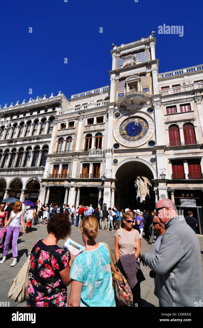 Venice, Italy - 6 May, 2012: Tourists visiting the St. Marc Clock Tower ...