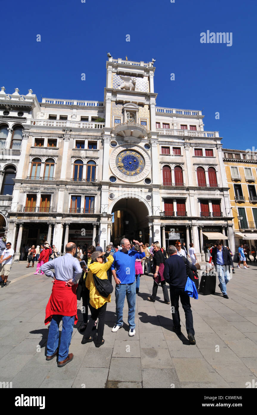 Venice, Italy - 6 May, 2012: Tourists visiting the St. Marc Clock Tower ...