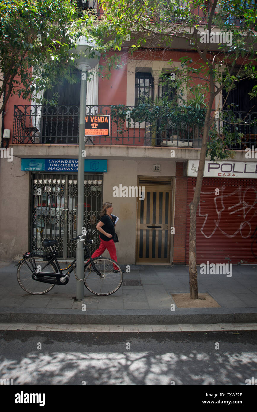 street scene, local woman walking on the pavement Stock Photo - Alamy