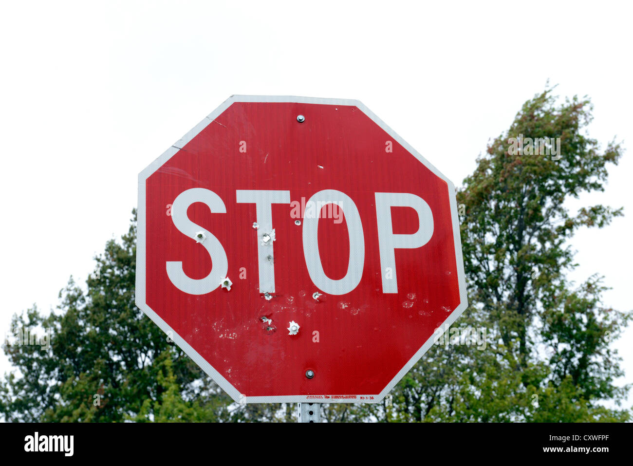 Bright red stop sign in rural Missouri USA - many bullet holes Stock ...