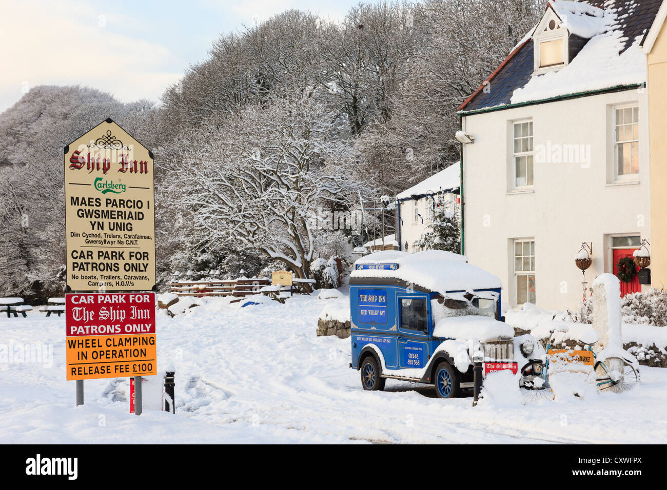 Sign and vintage car advertising the Ship Inn historic village pub in ...