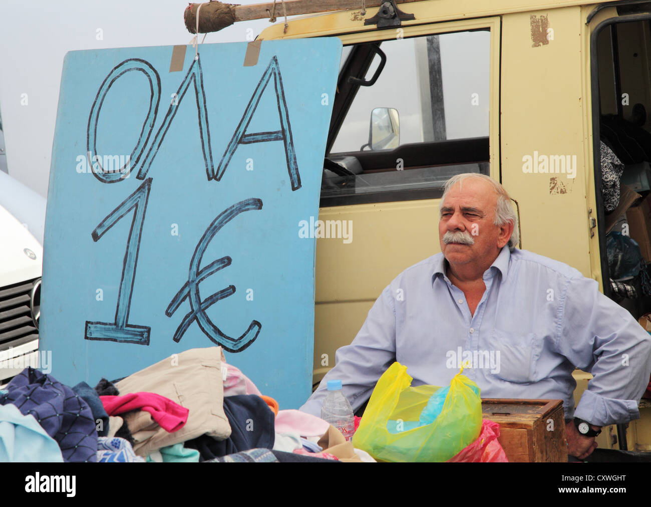 Market trader selling clothes for one euro open air street market ...