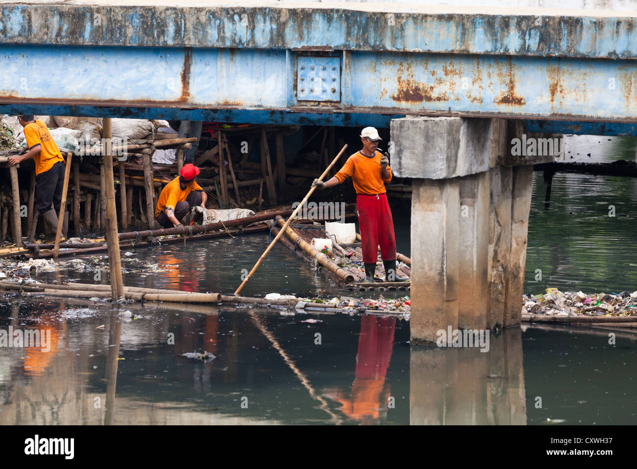 Workers cleaning a Canal in Jakarta, Indonesia Stock Photo - Alamy