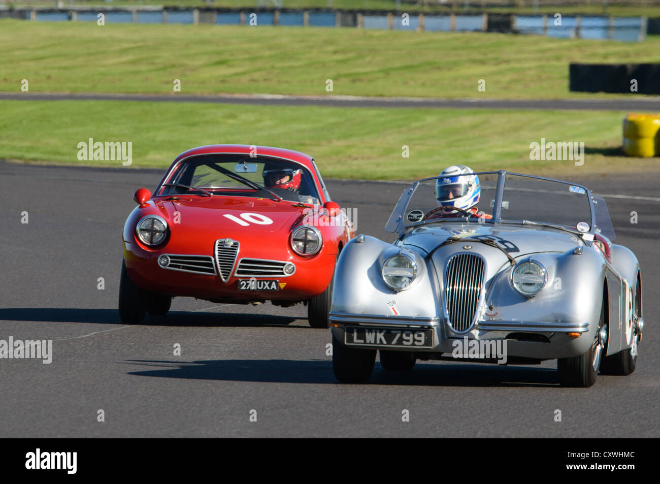 Classic cars racing around Castle Combe circuit Stock Photo - Alamy