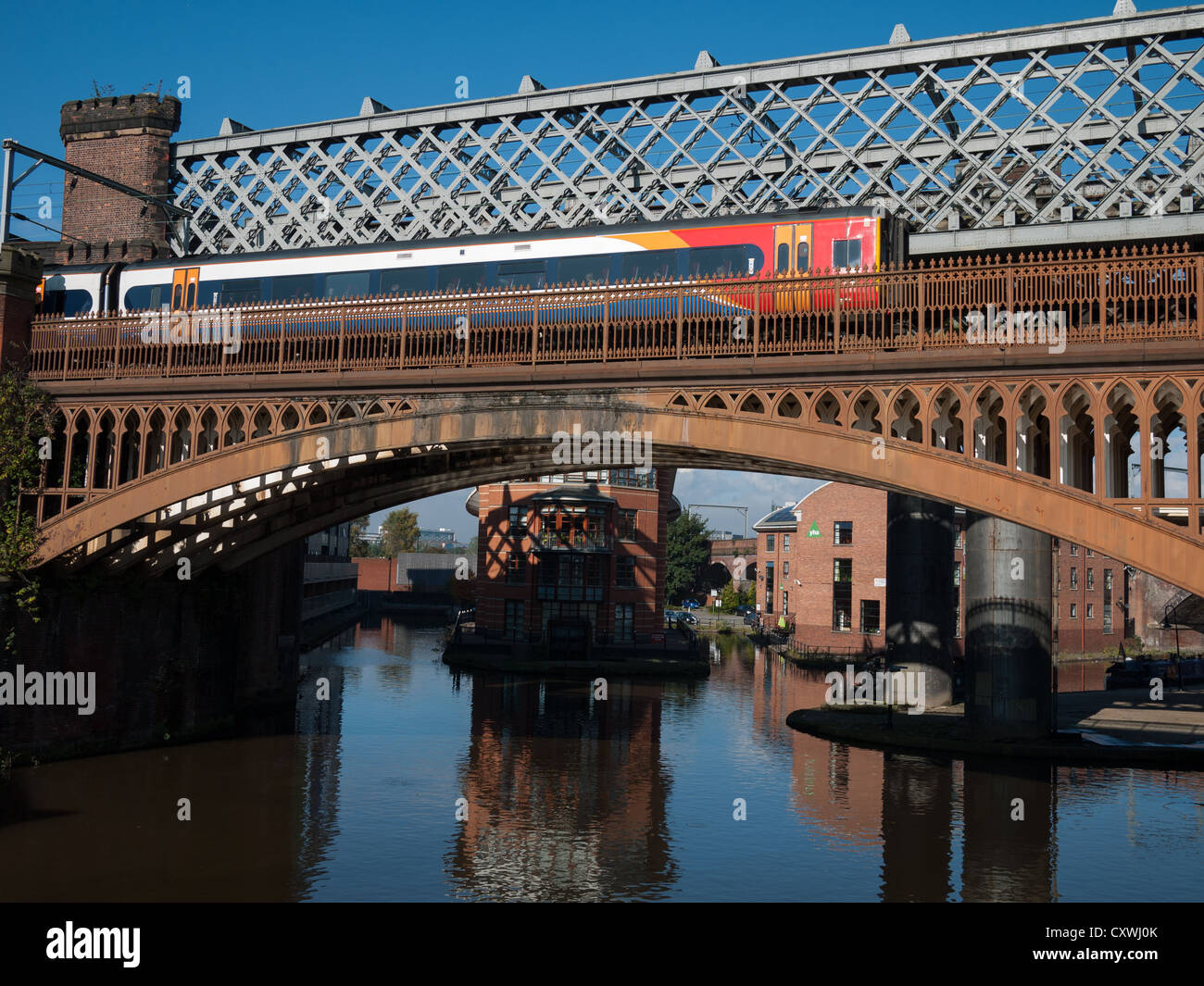 Train passing over bridge, Castlefield, Manchester Stock Photo - Alamy