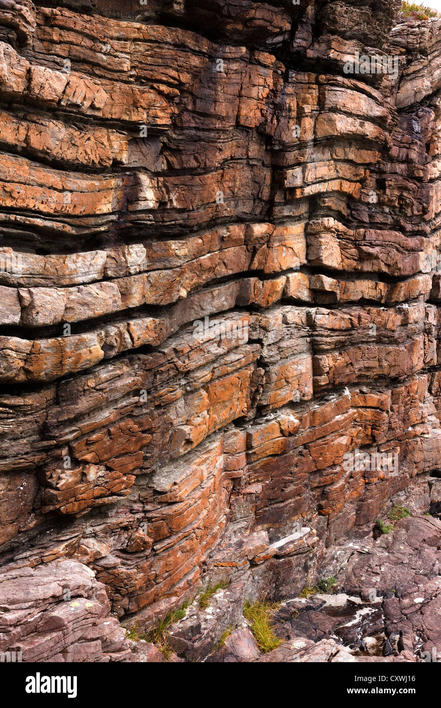 Eroded sedimentary sandstone rock strata on cliffs at Camas Daraich Bay ...