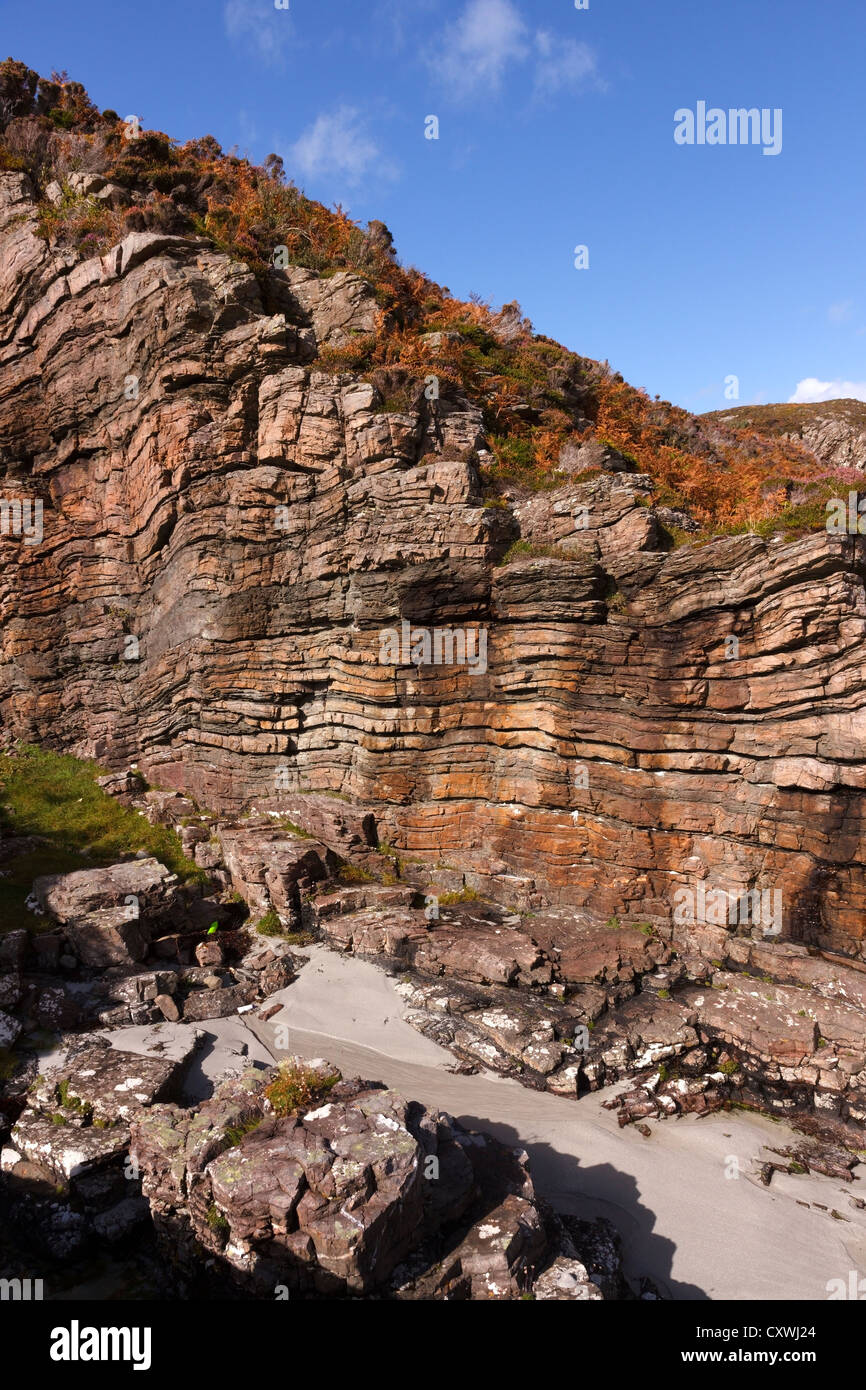 Eroded sedimentary sandstone rock strata on cliffs at Camas Daraich Bay ...