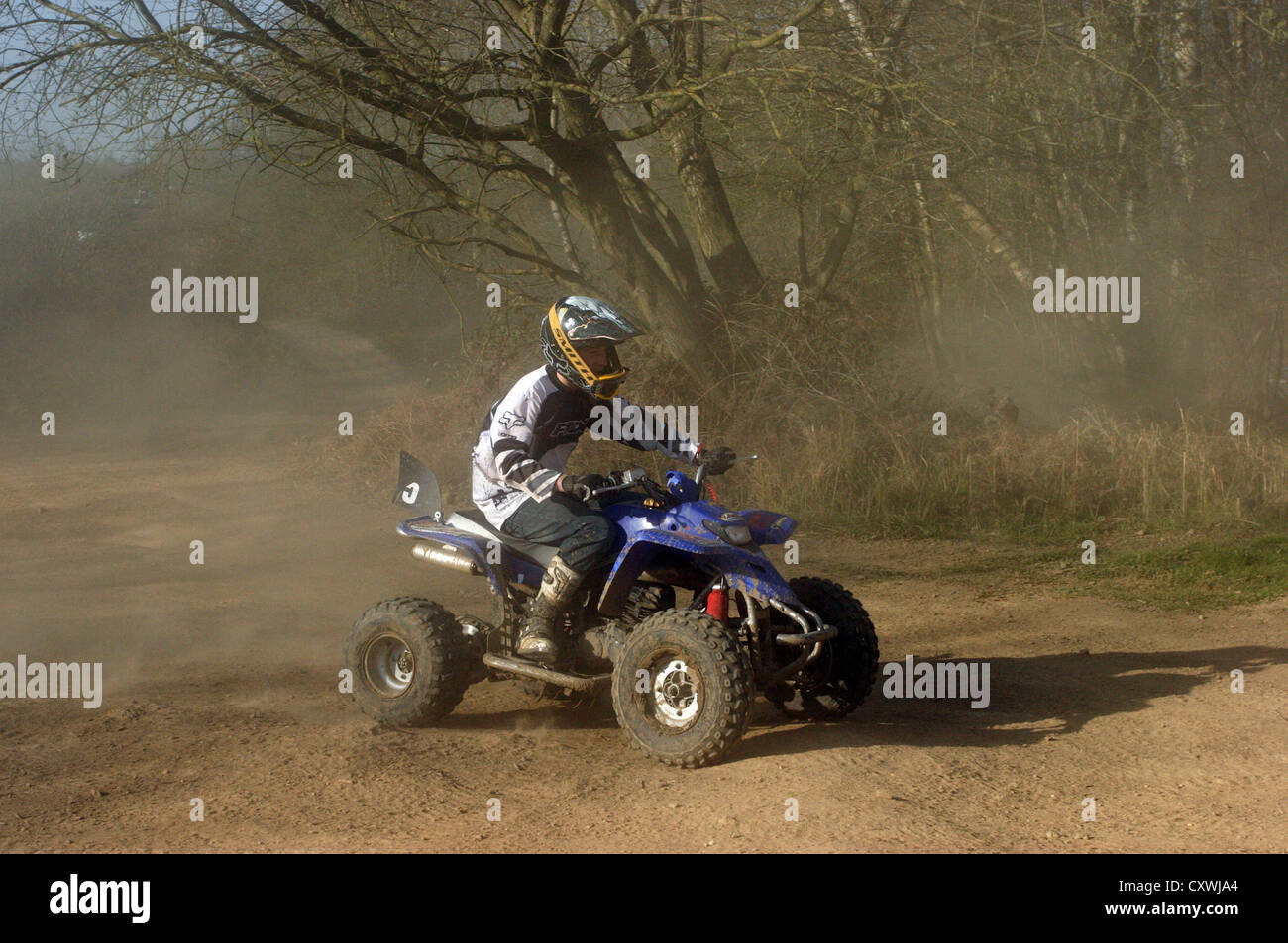 Quad biking on waste ground in Wiltshire, 28th March 2012 Stock Photo ...