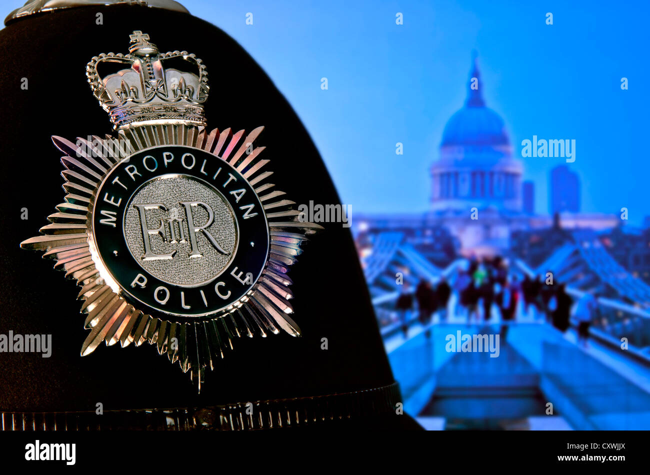 Metropolitan police constable helmet and badge with Saint Paul's ...