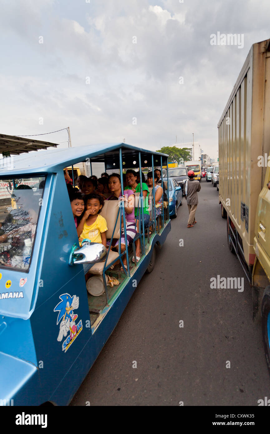 Children on a Minibus in Jakarta, Indonesia Stock Photo - Alamy